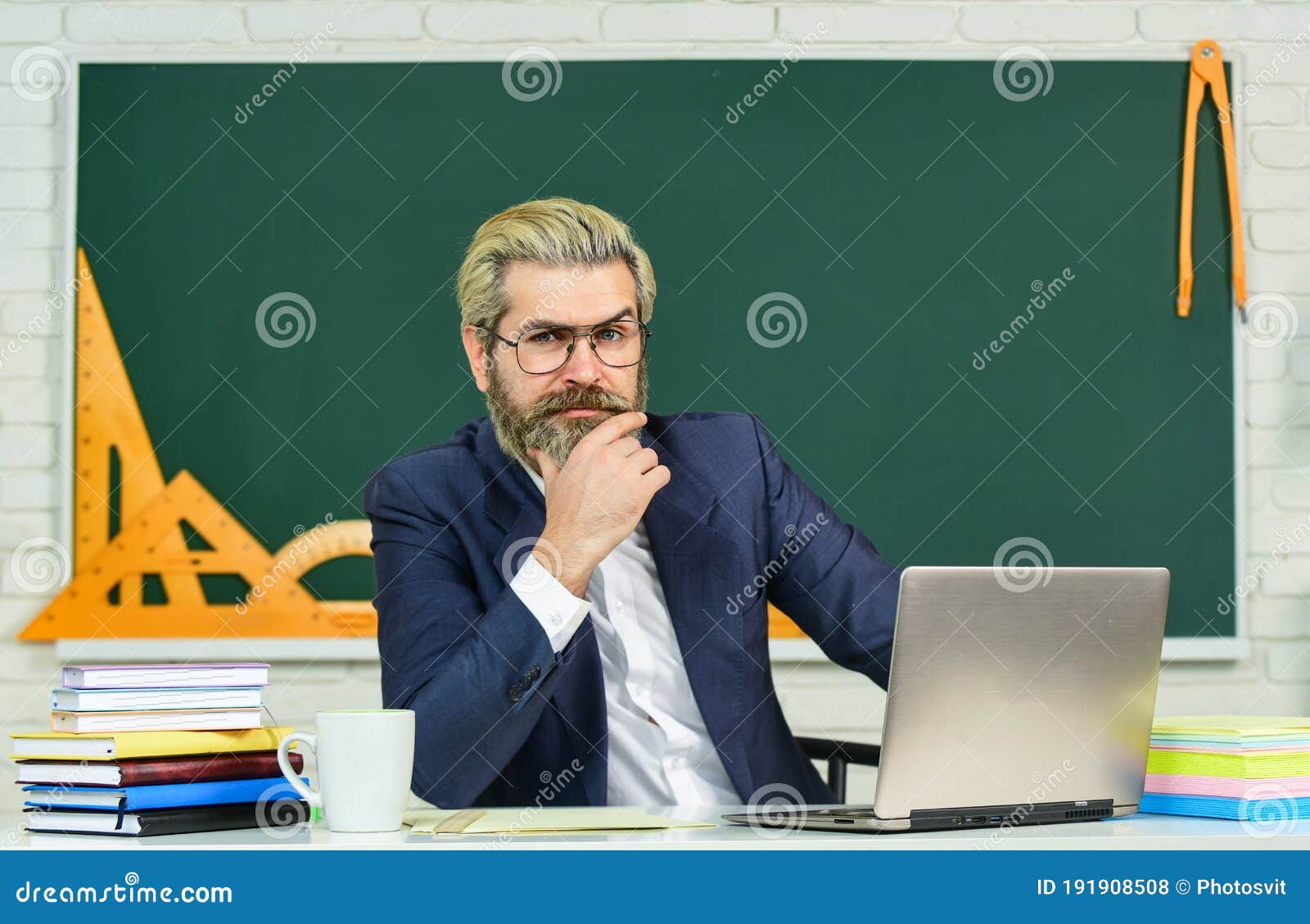 Digital Technology Enhances Education. Senior Teacher Use Laptop in ...