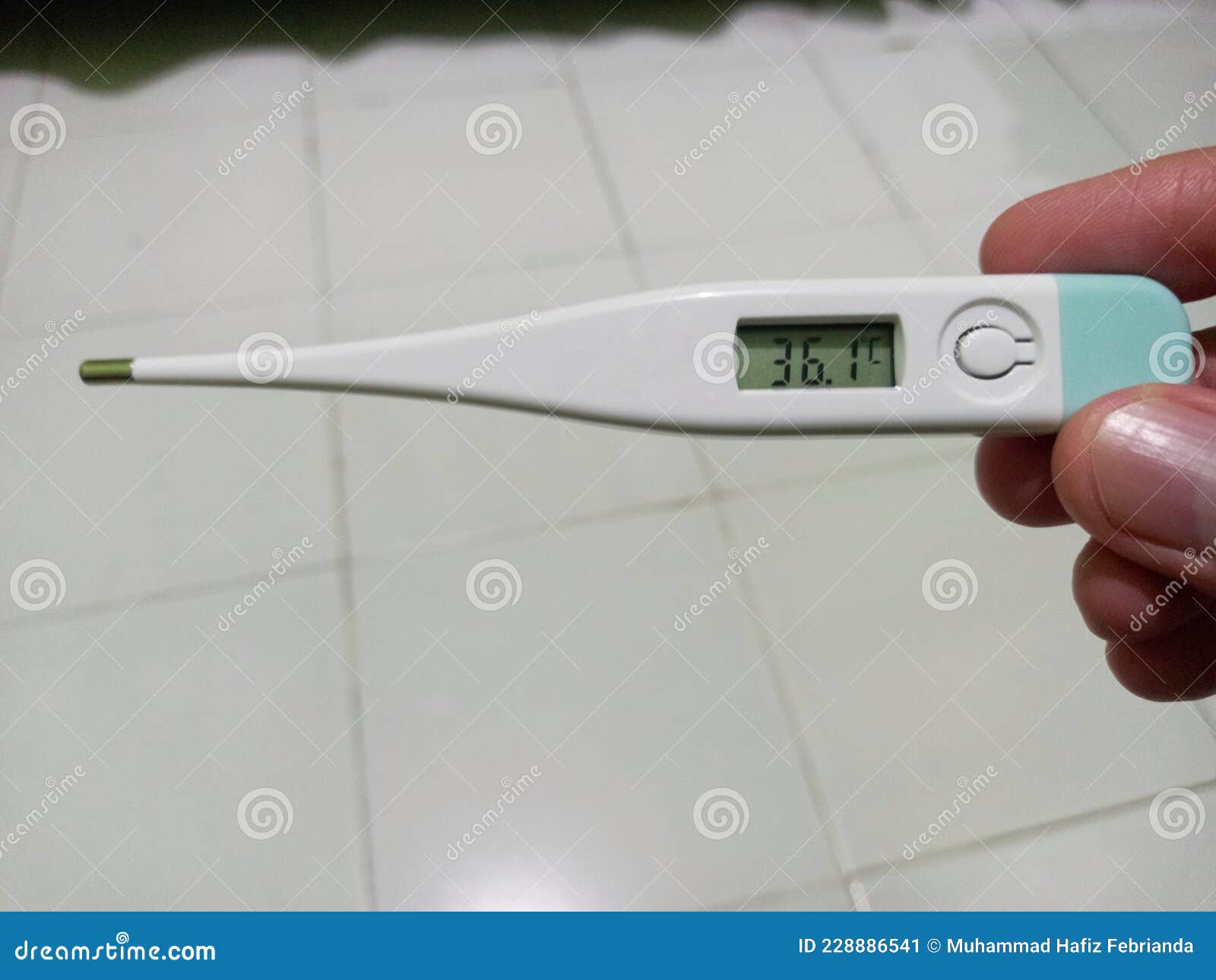 Digital Thermometer in Man Hand with an Index of 36.1 Degrees Celsius ...