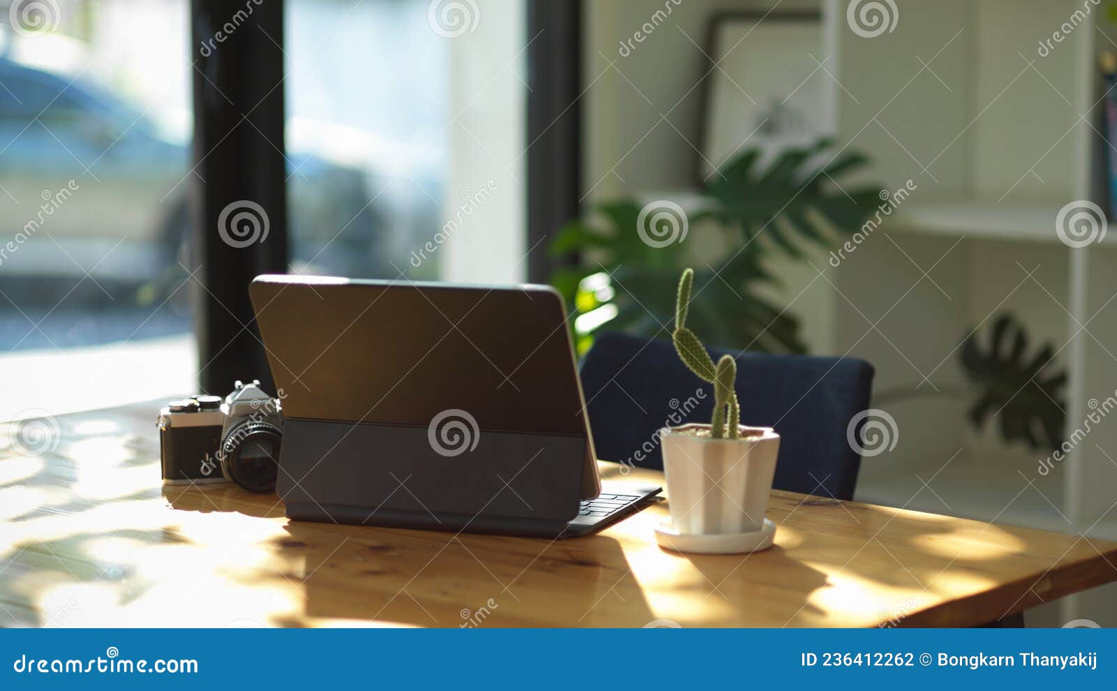 Digital Touchpad Tablet Computer and Camera on a Table Stock Photo ...