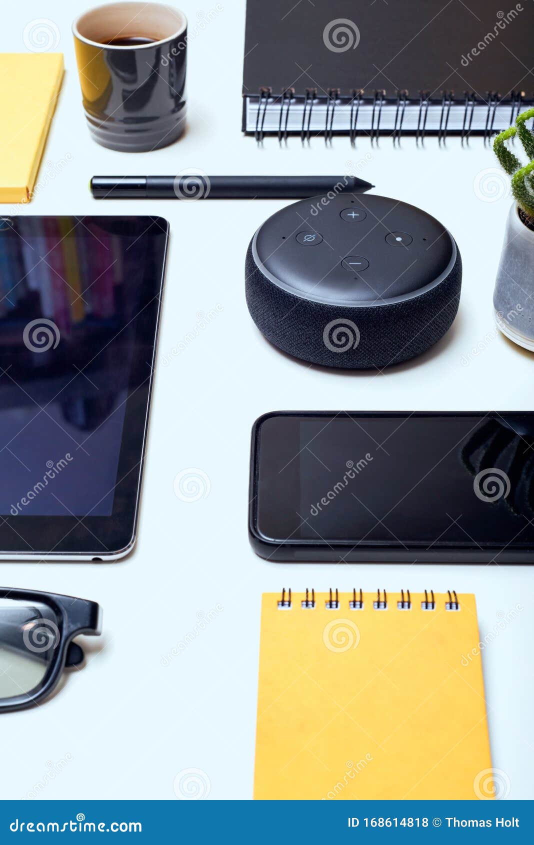 Digital and Wireless Technology Objects Arranged on a White Desk ...