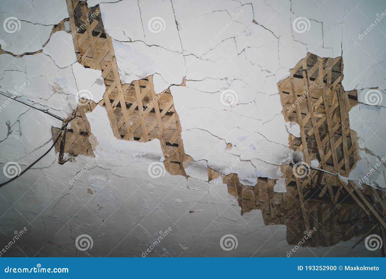 Dilapidated Ceiling of an Old House. Damaged Wall with a Hole with ...