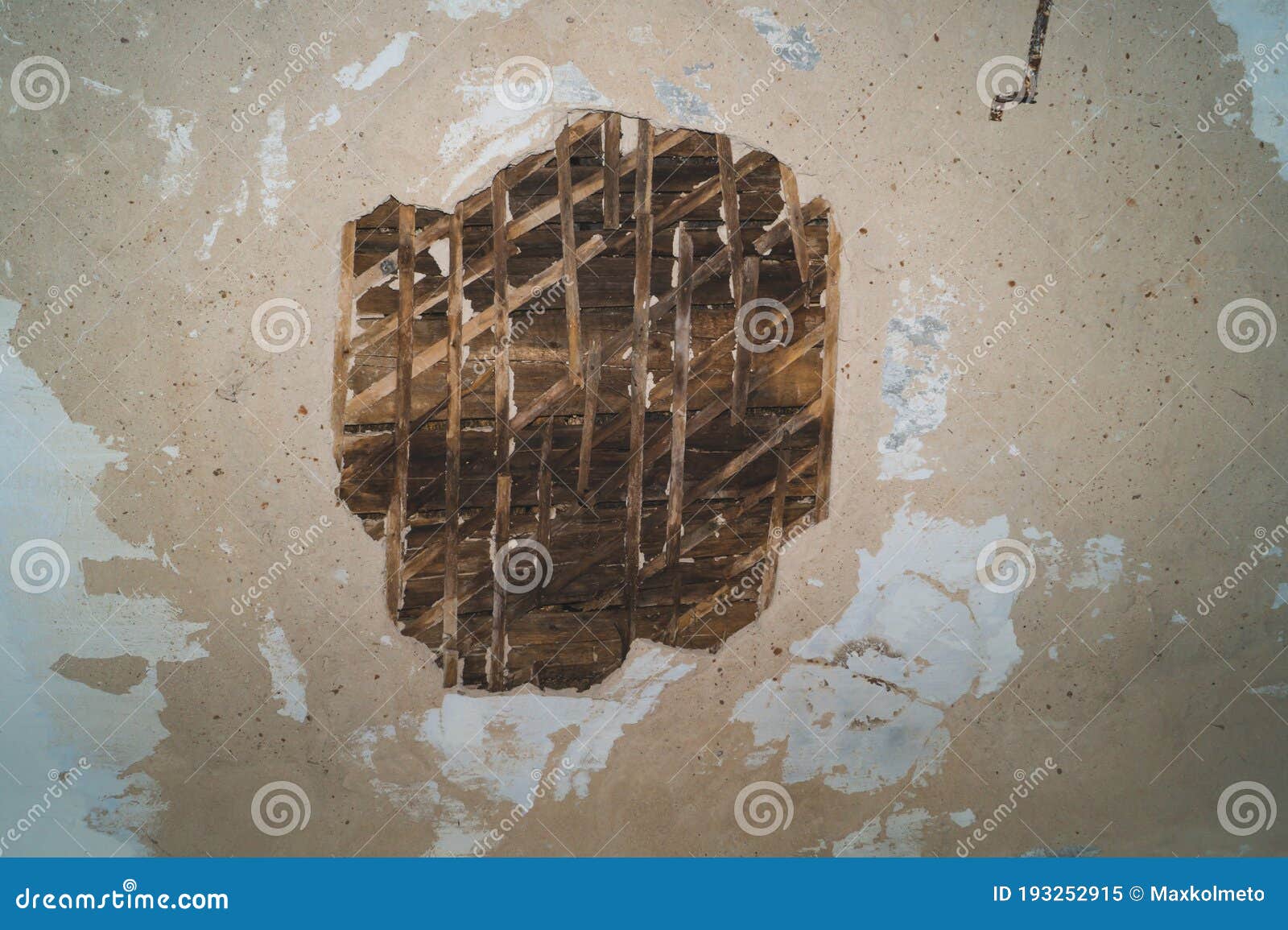 Dilapidated Ceiling of an Old House. Damaged Wall with a Hole with ...
