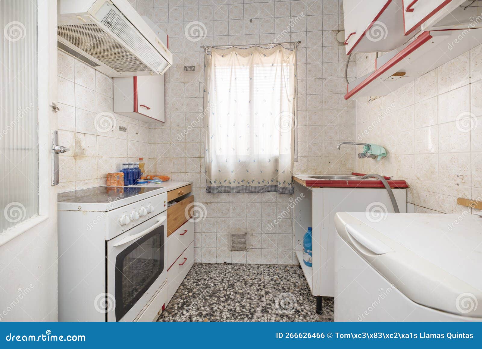 Dilapidated Kitchen Front with Tiles and Old Appliances Stock Photo ...