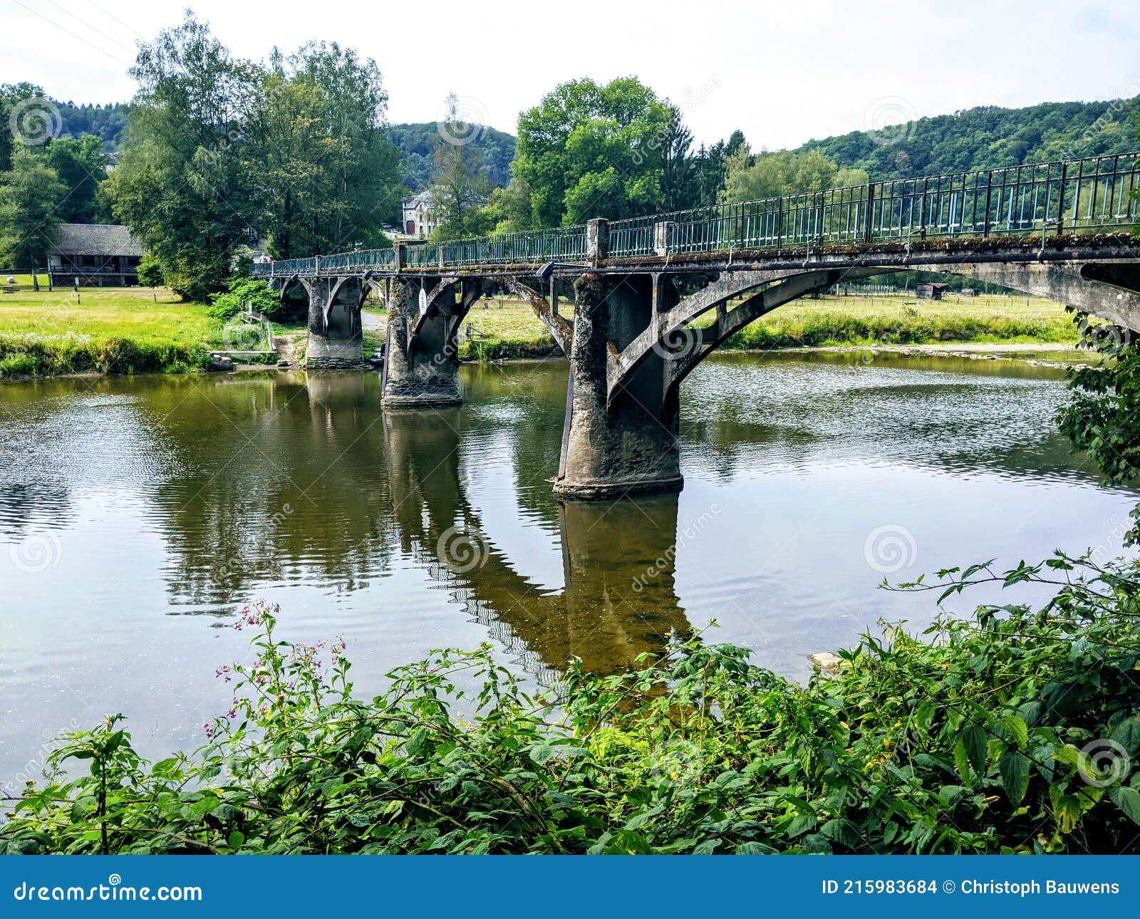 A Dilapidated Pedestrian Bridge Over a Fordable River Stock Photo ...