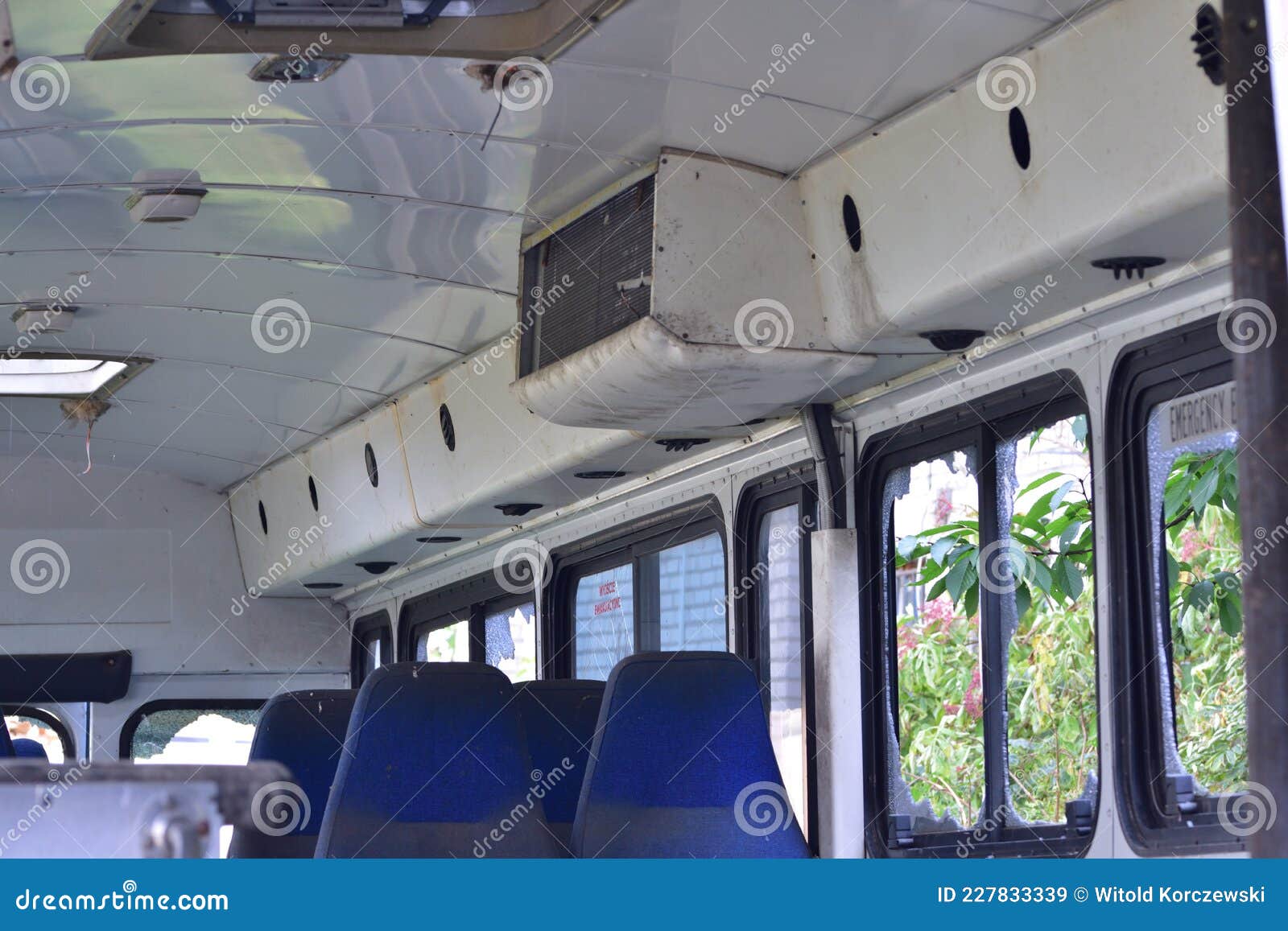 Dilapidated and Rusty Bus with Broken Windows in a Remote Area. Scrap ...