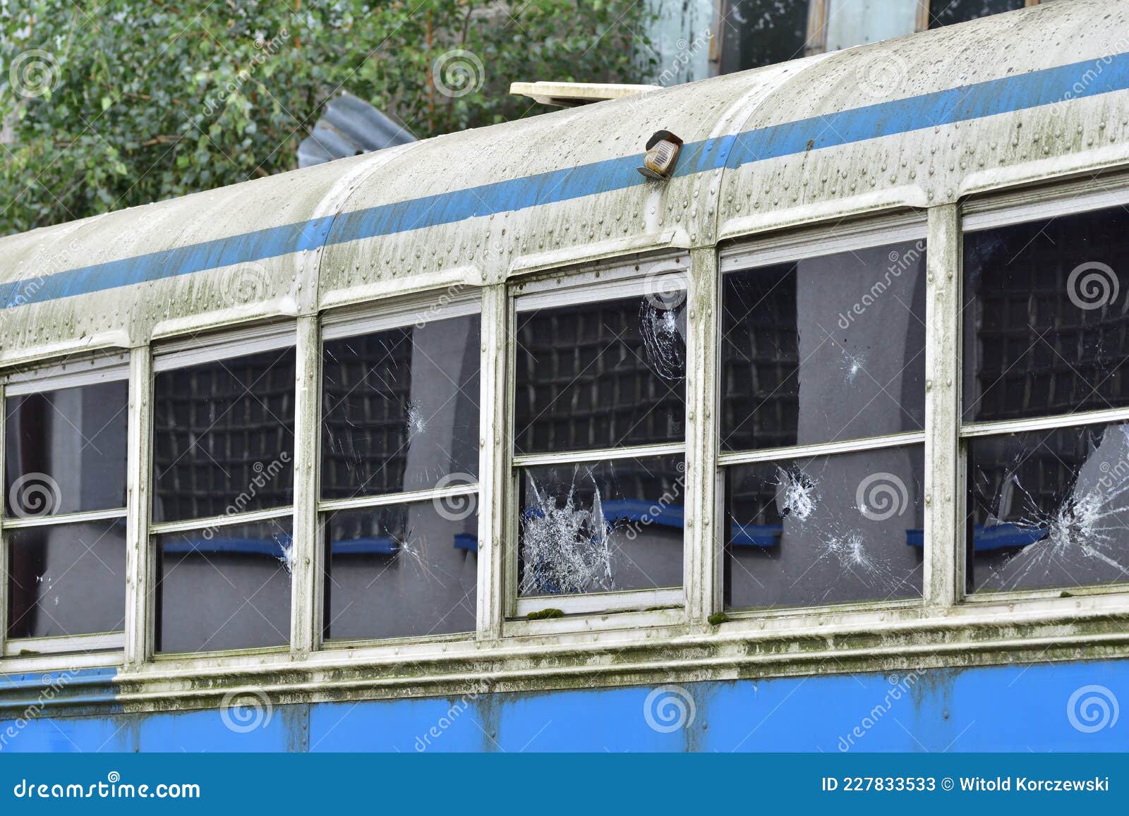 Dilapidated and Rusty Bus with Broken Windows in a Remote Area. Scrap ...