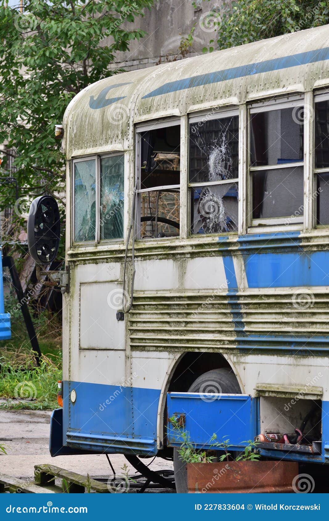 Dilapidated and Rusty Bus with Broken Windows in a Remote Area. Scrap ...