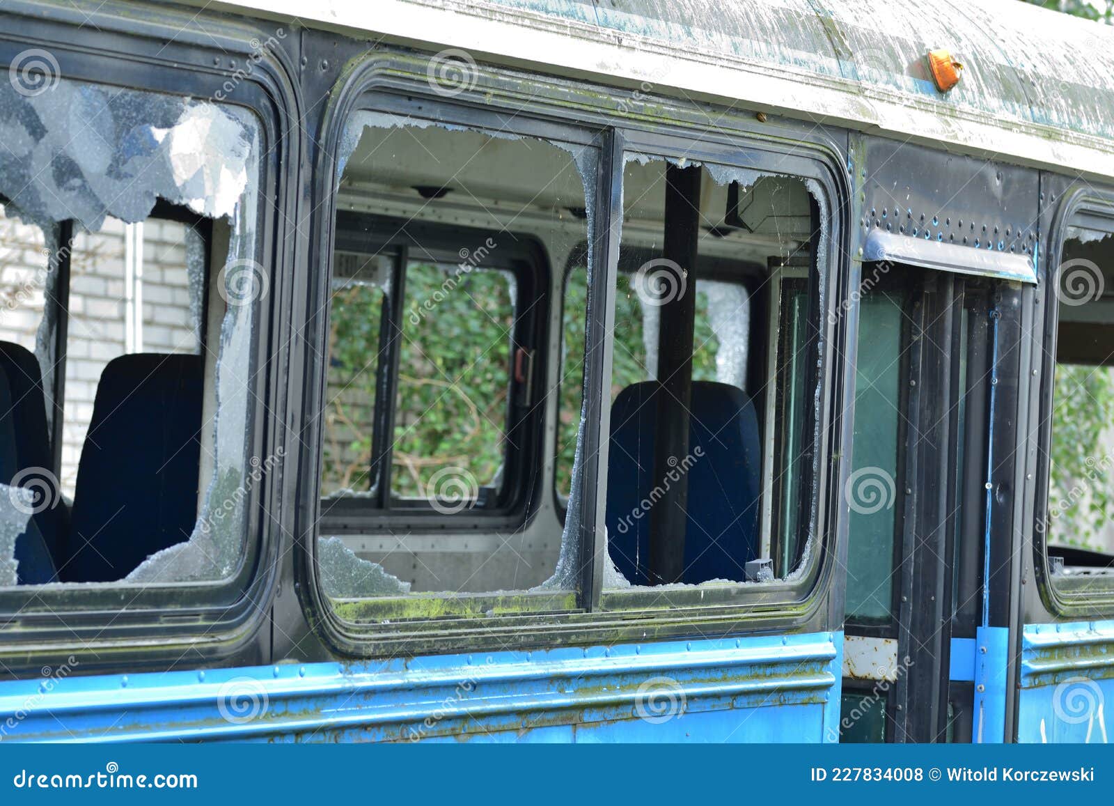 Dilapidated and Rusty Bus with Broken Windows in a Remote Area. Scrap ...