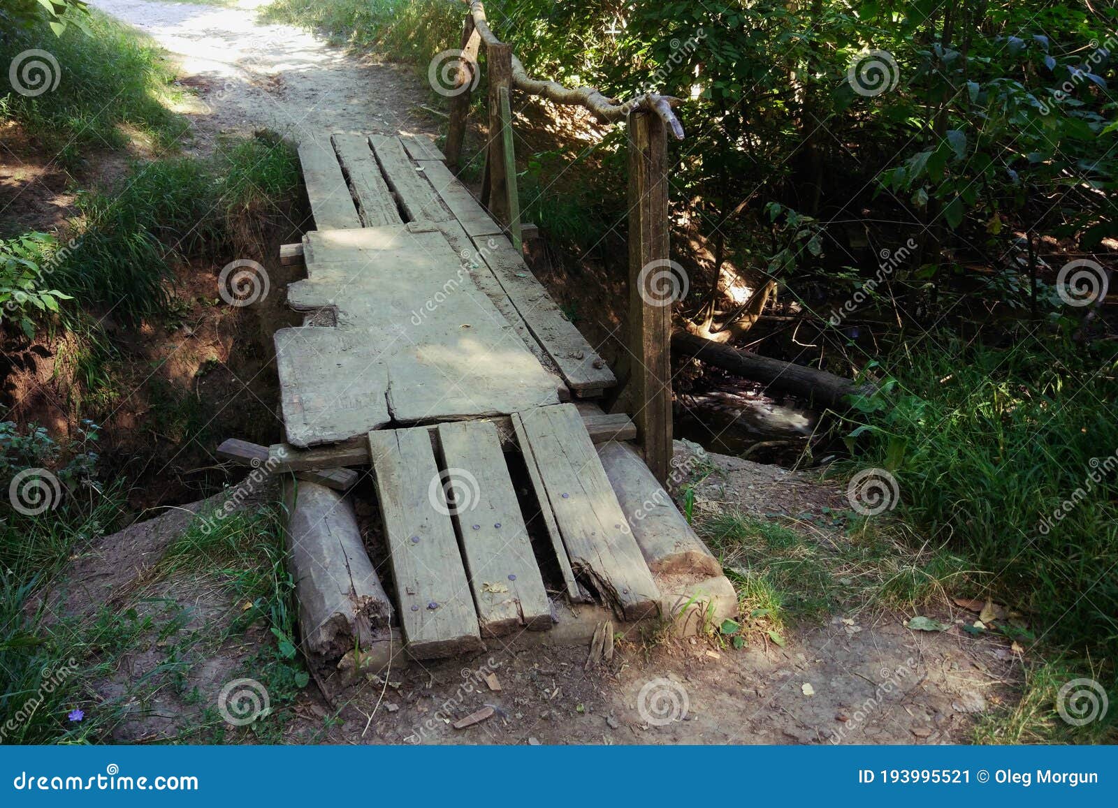 A Dilapidated Wooden Bridge Over a Forest River. Dangerous River ...