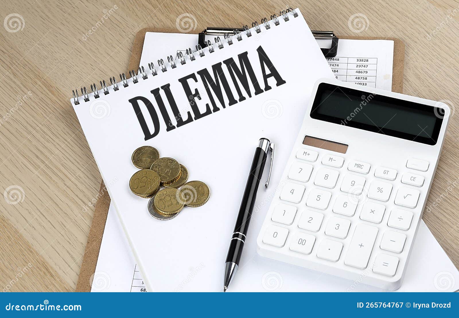 DILEMMA Text on a Notebook with Chart and Calculator and Coins ...