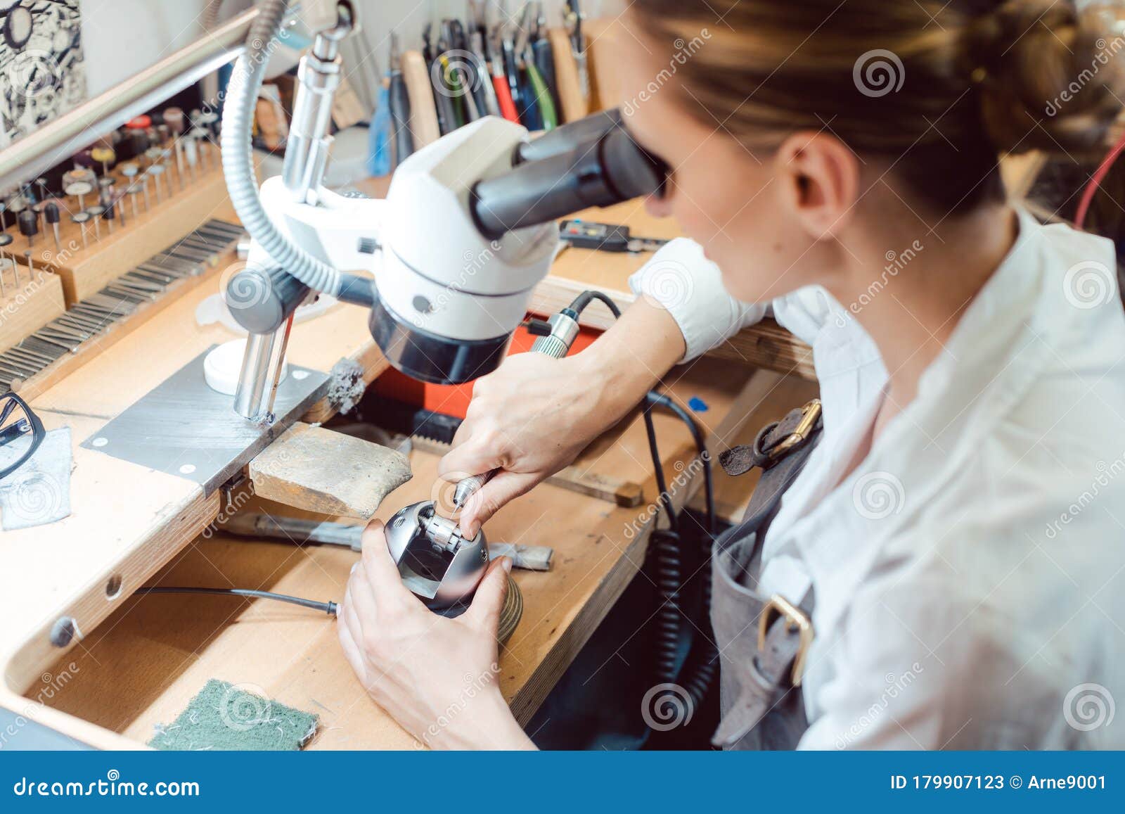 Diligent Jeweler Working on Microscope at Her Workbench Stock Image ...