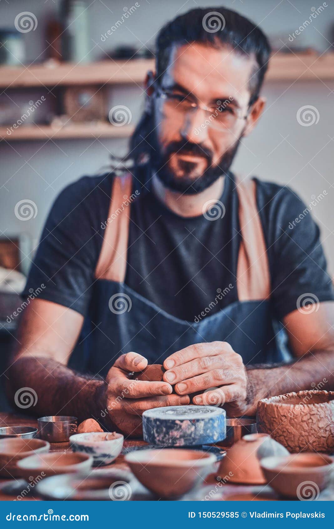 Diligent Man in Glasses at His Pottery Workshop is Workig for New ...