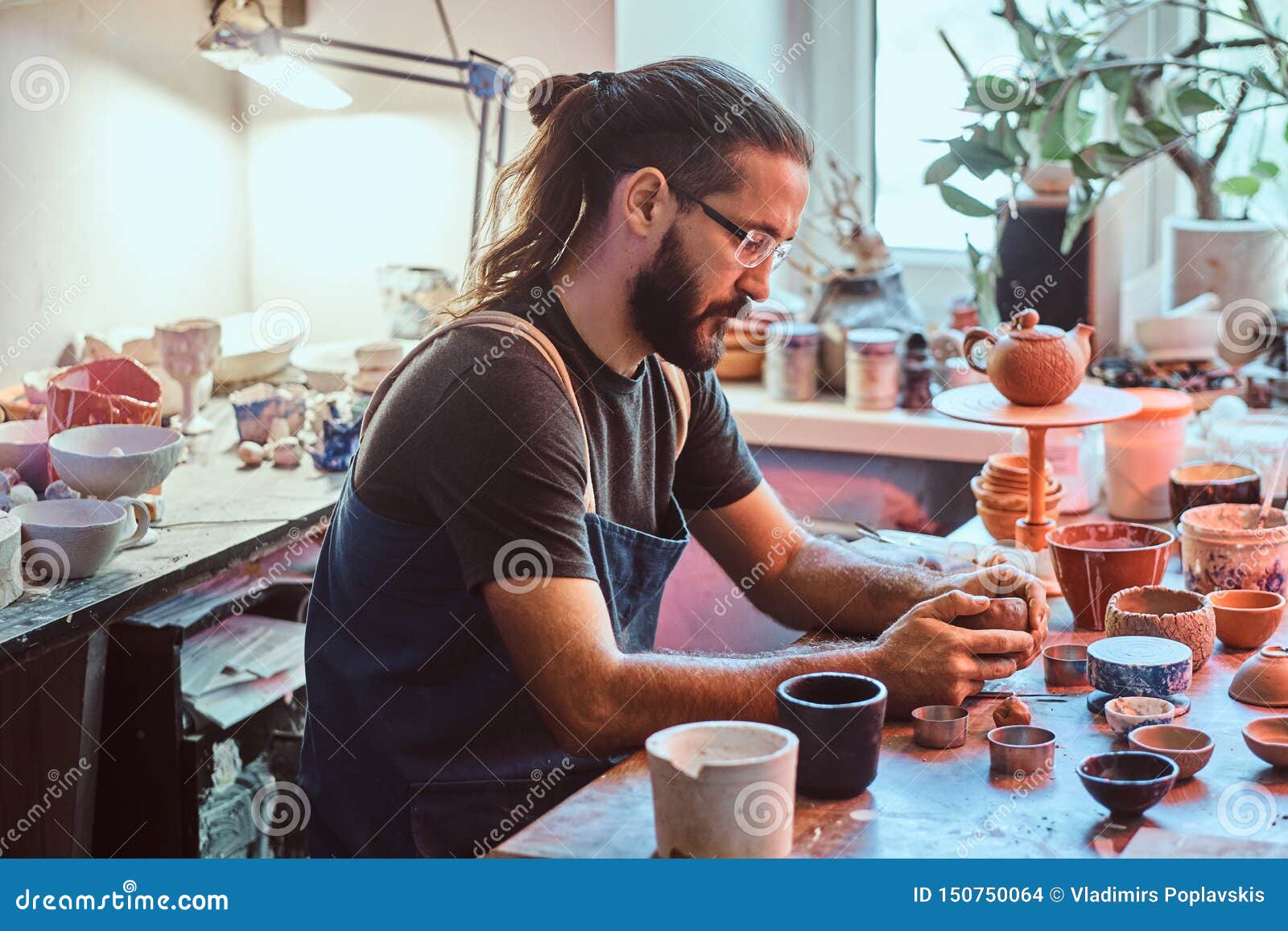 Diligent Man in Glasses at His Pottery Workshop is Workig for New ...