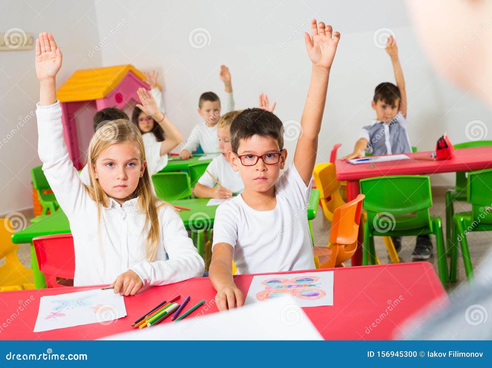 Diligent Schoolchildren with Hands Raised Stock Photo - Image of child ...