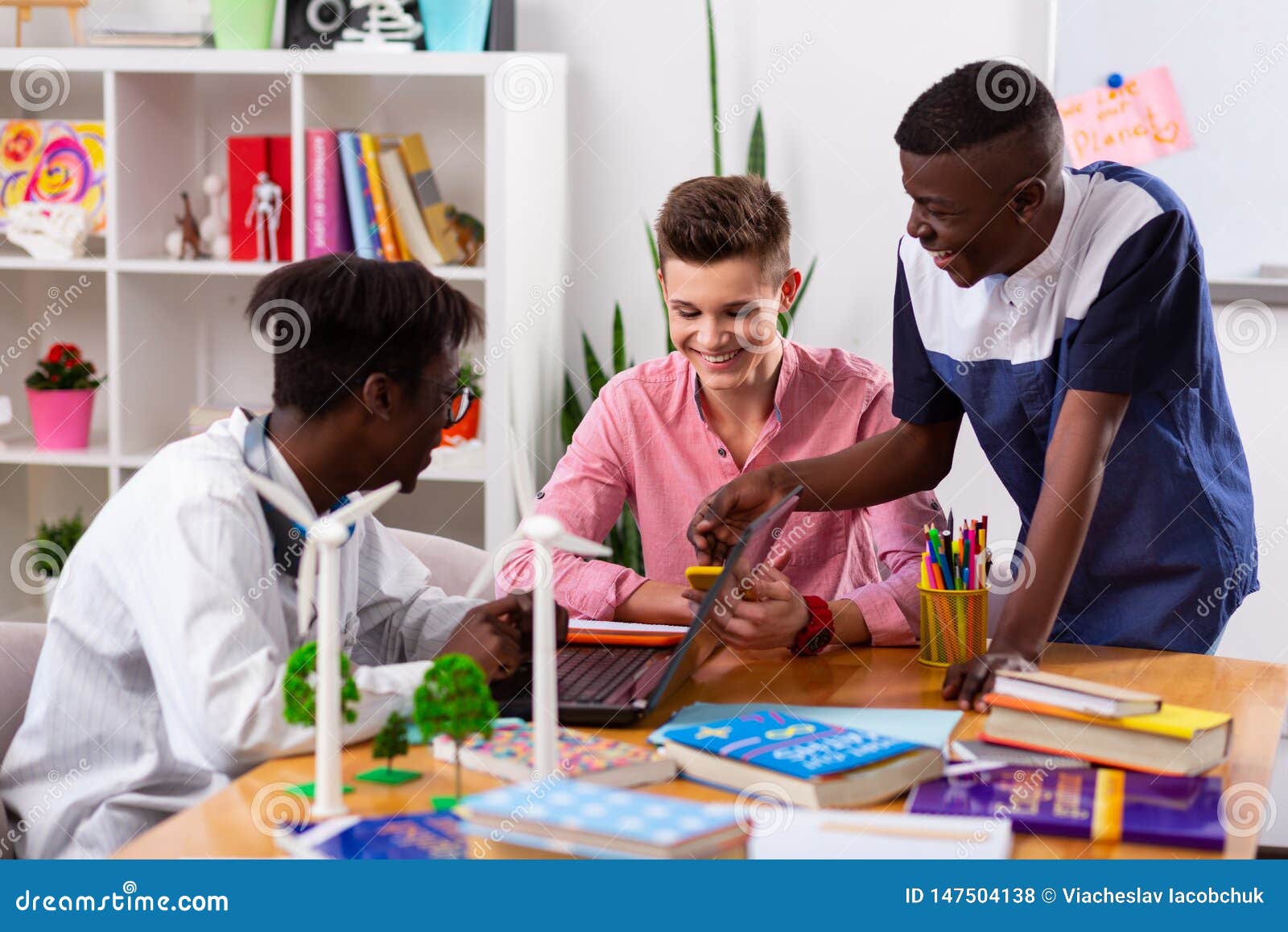 Diligent Students Using Laptop and Phone Preparing Project Together ...