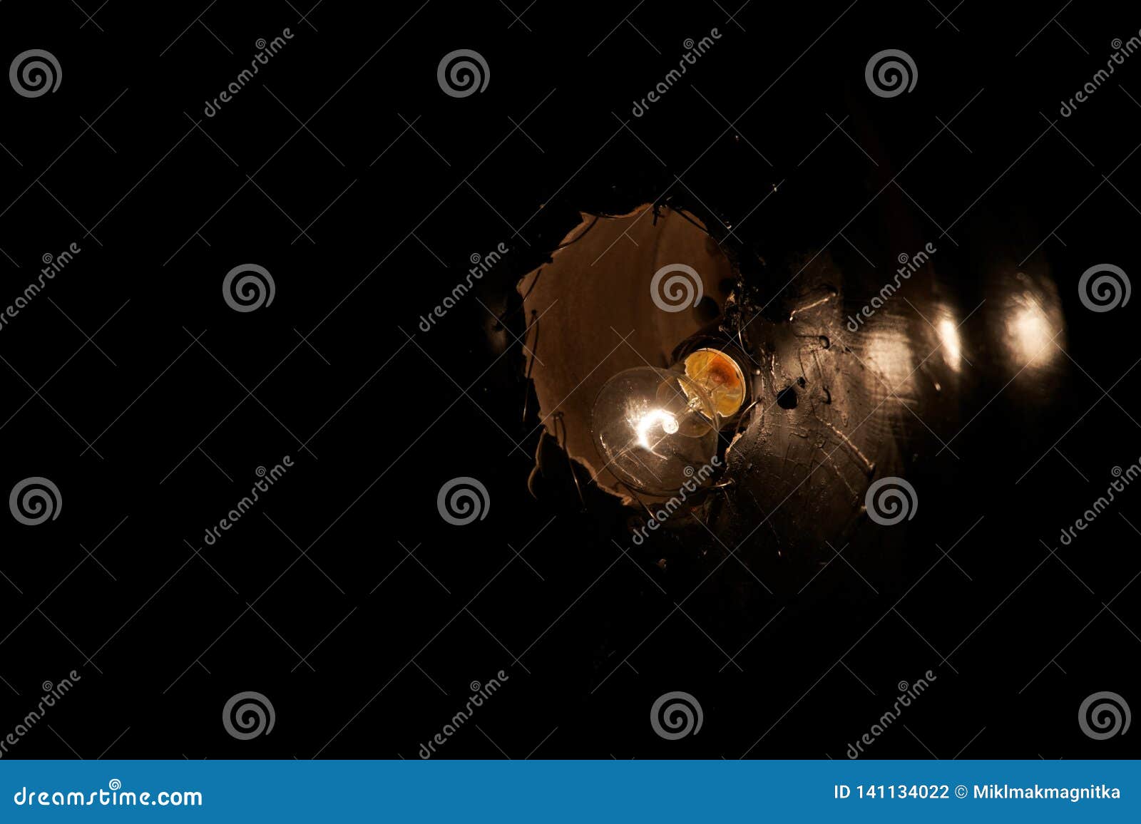 A Dim Incandescent Lamp Shines through a Black Hole in the Ceiling ...