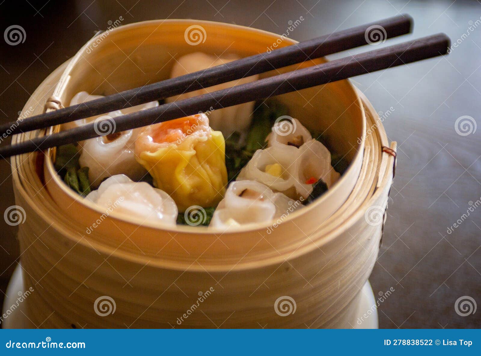 Dim sum in a basket stock photo. Image of plated, culinary - 278838522