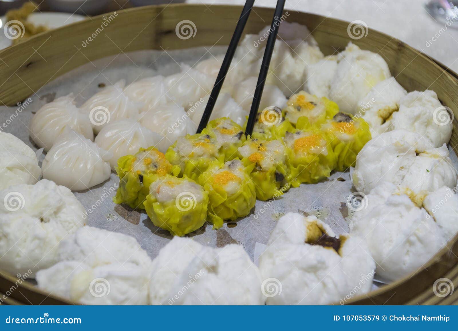 Dim Sum Dumplings with Steamed Buns in the Container and Chopsticks ...
