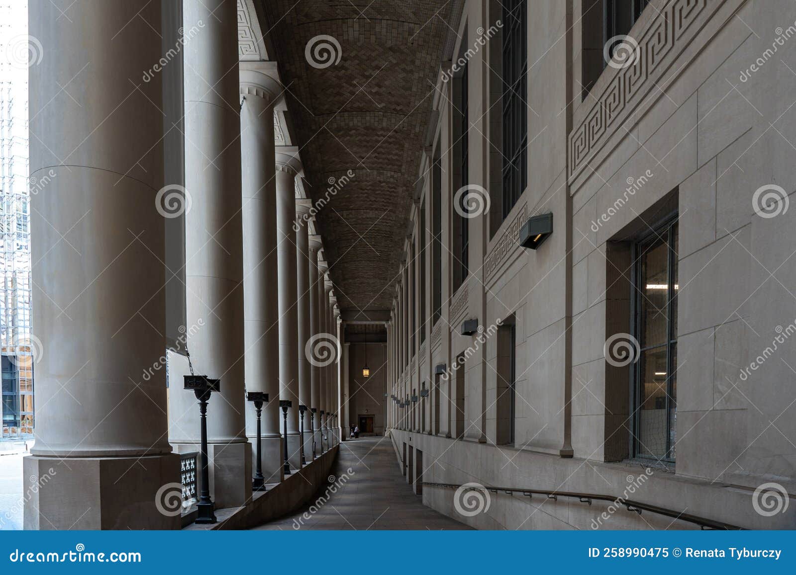 Diminishing Perspective of Exterior Dark Hallway with Columns on One ...