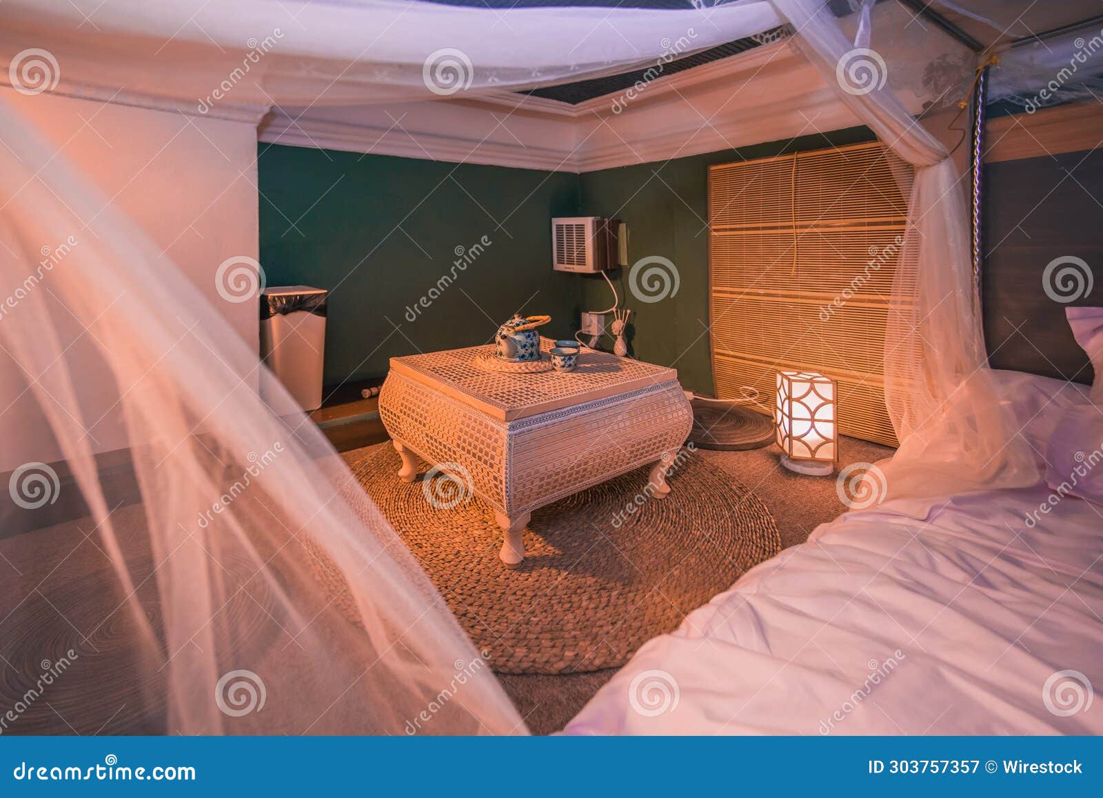 Dimly Lit Bedroom Design with a Table with a Kettle on it Stock Image ...