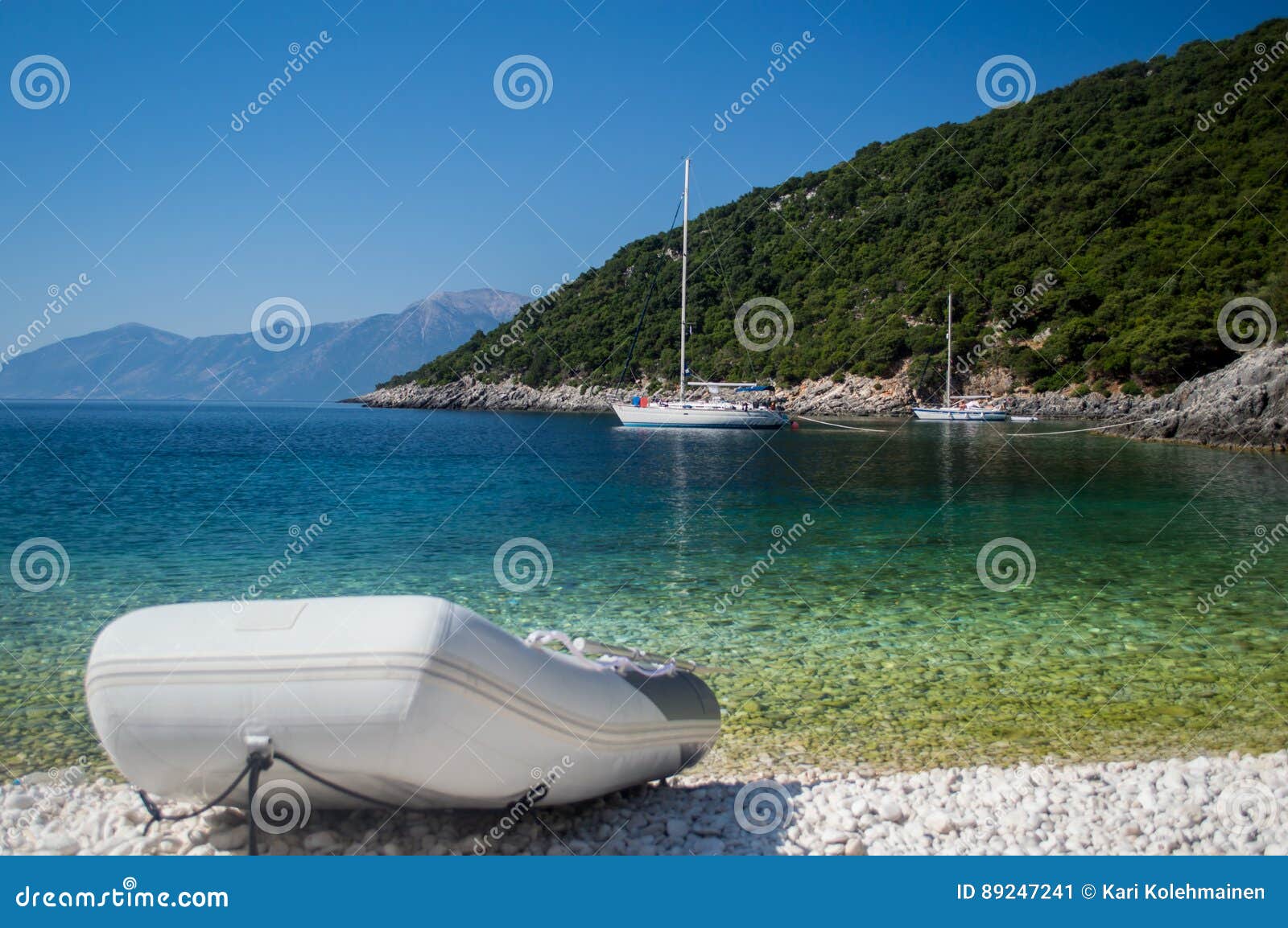 Dinghy at a remote beach stock image. Image of clear - 89247241