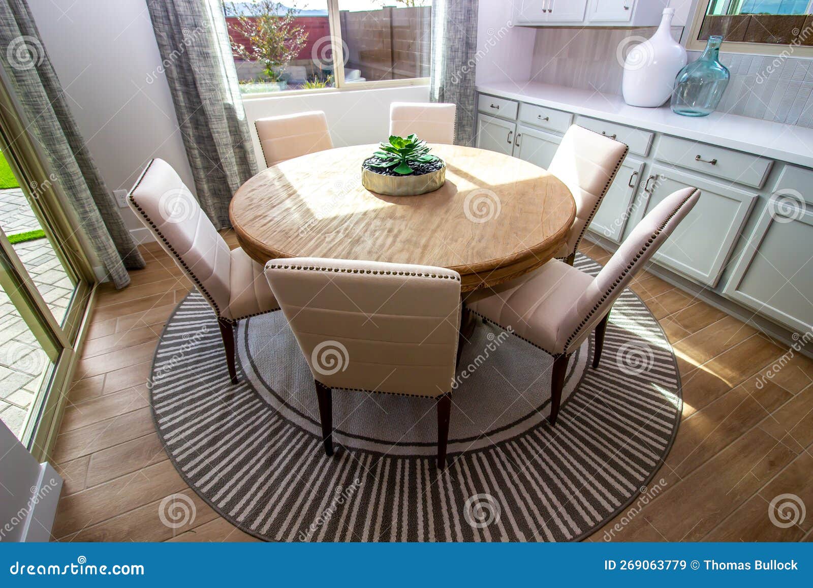 Dining Area Round Table with Six High Back Chairs Stock Image - Image ...