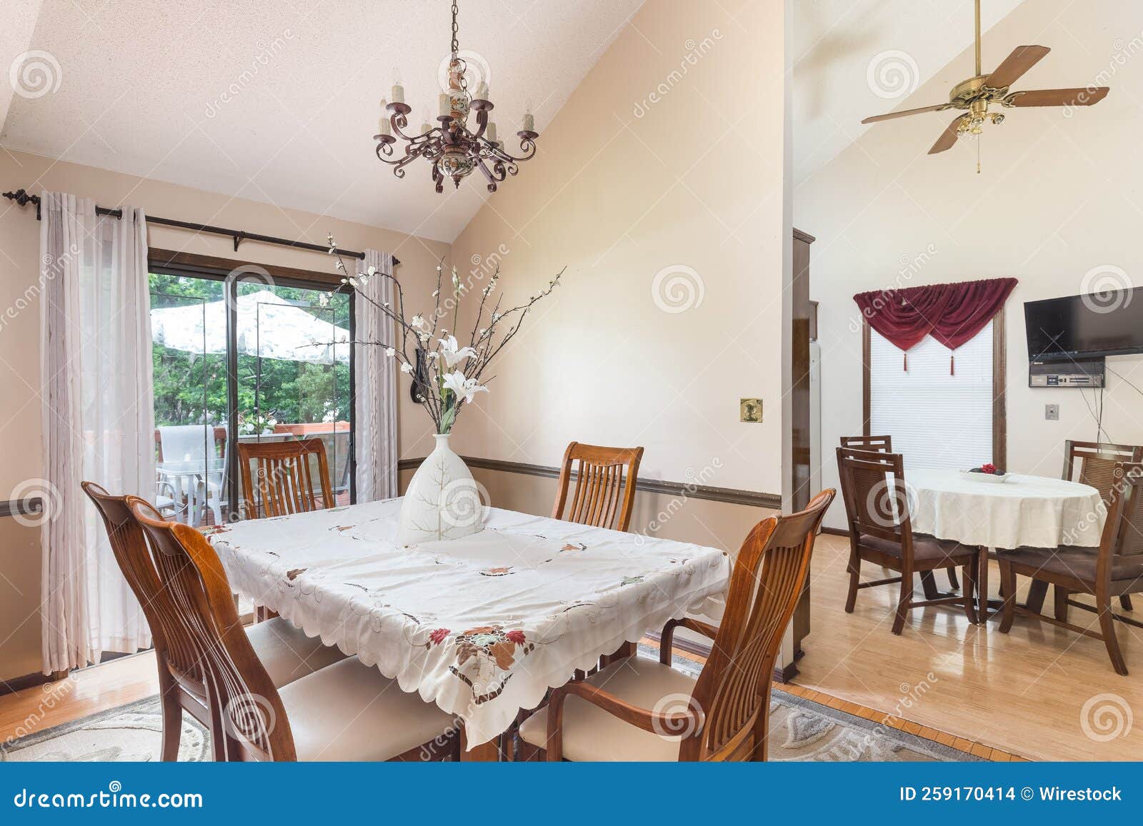 Dining Room with a Rectangular Table Connected To the Kitchen in White ...