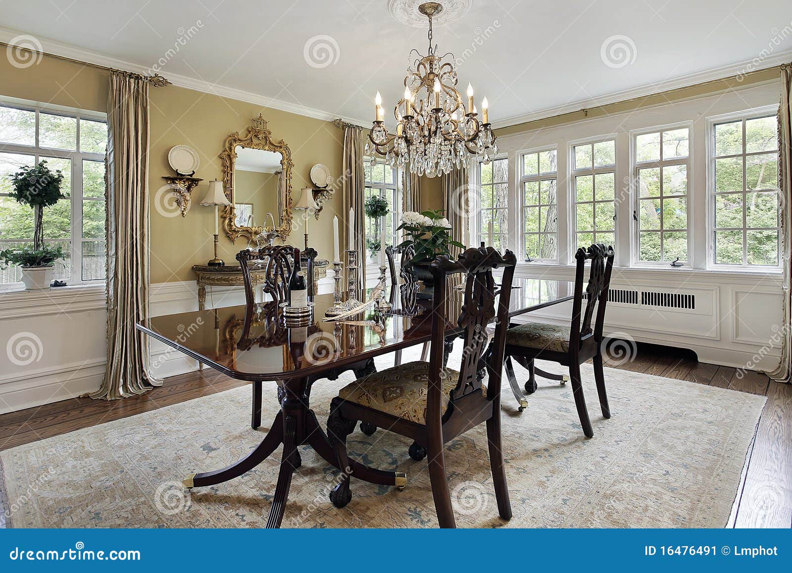 Dining room with tan walls stock image. Image of fixtures - 16476491