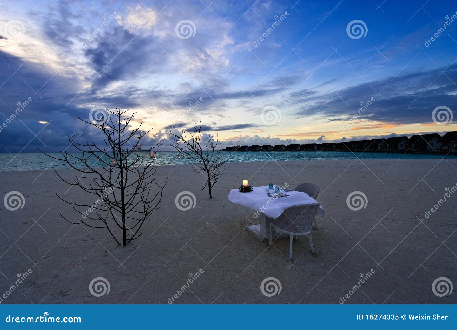 Dining table on the beach stock image. Image of maldives - 16274335