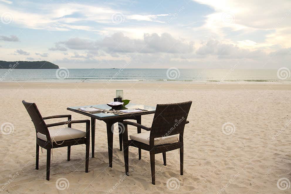 Dining table on beach stock image. Image of elegant, couples - 26008143