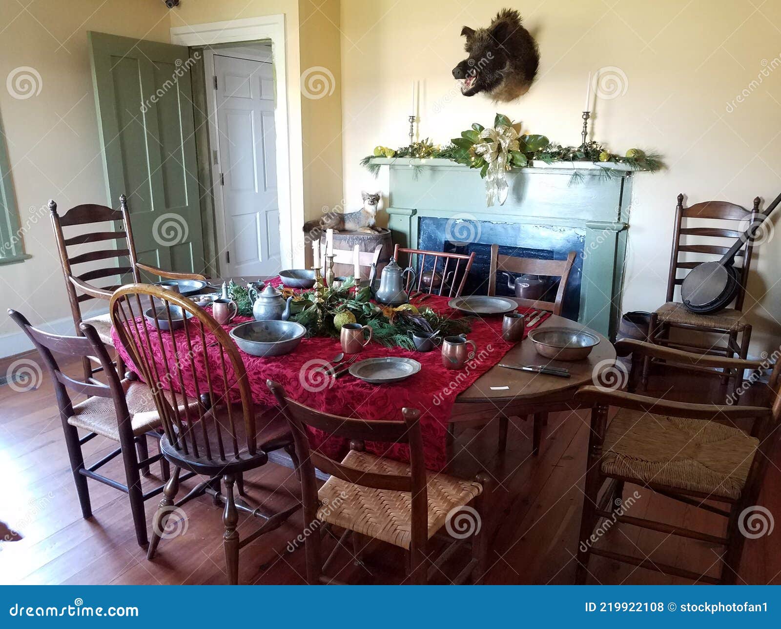 Dining Table with Bowls and Stuffed Pig Head and Fox Stock Photo ...