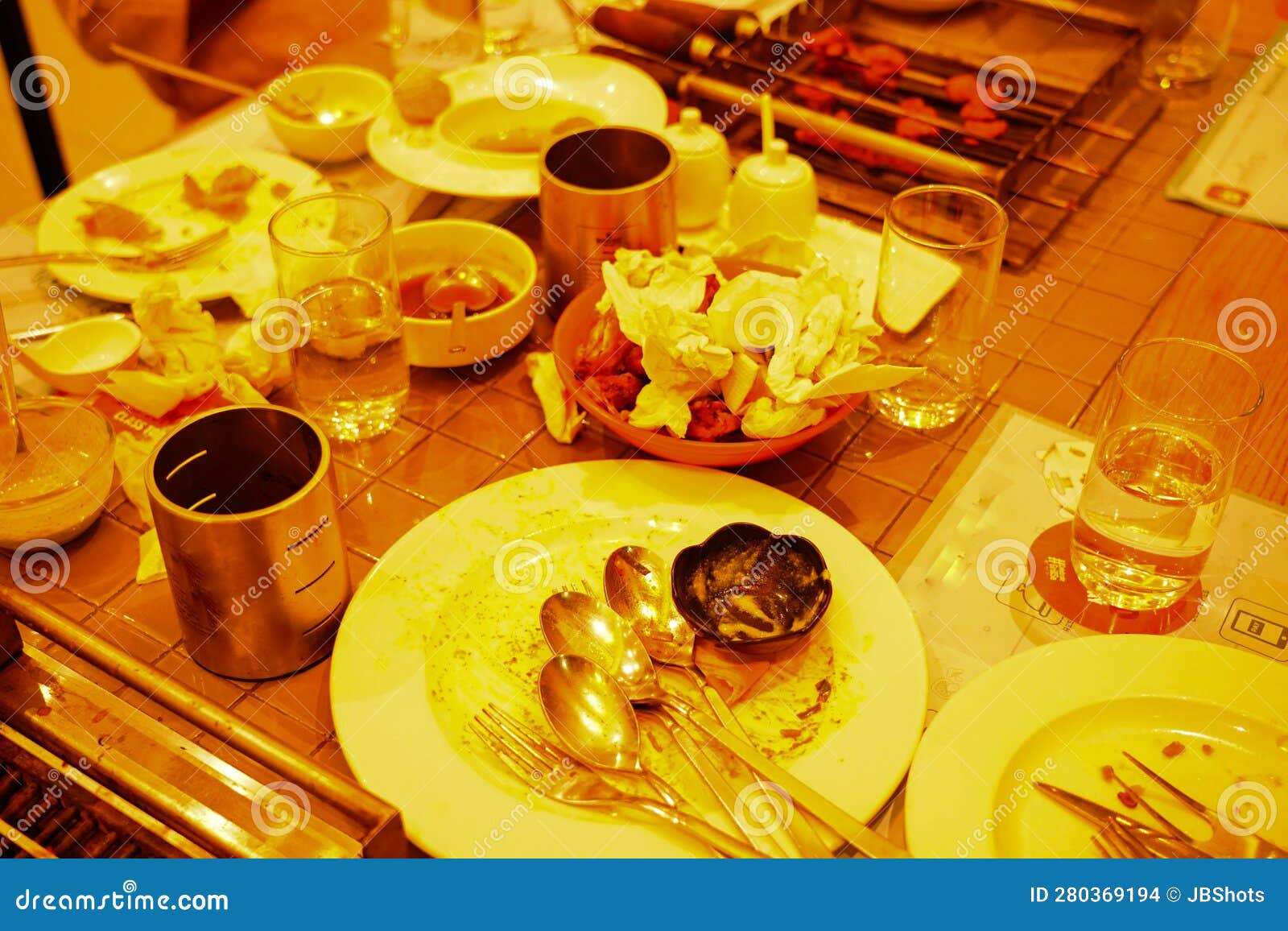 A Dining Table after a Dinner in Warm Light Stock Photo - Image of ...