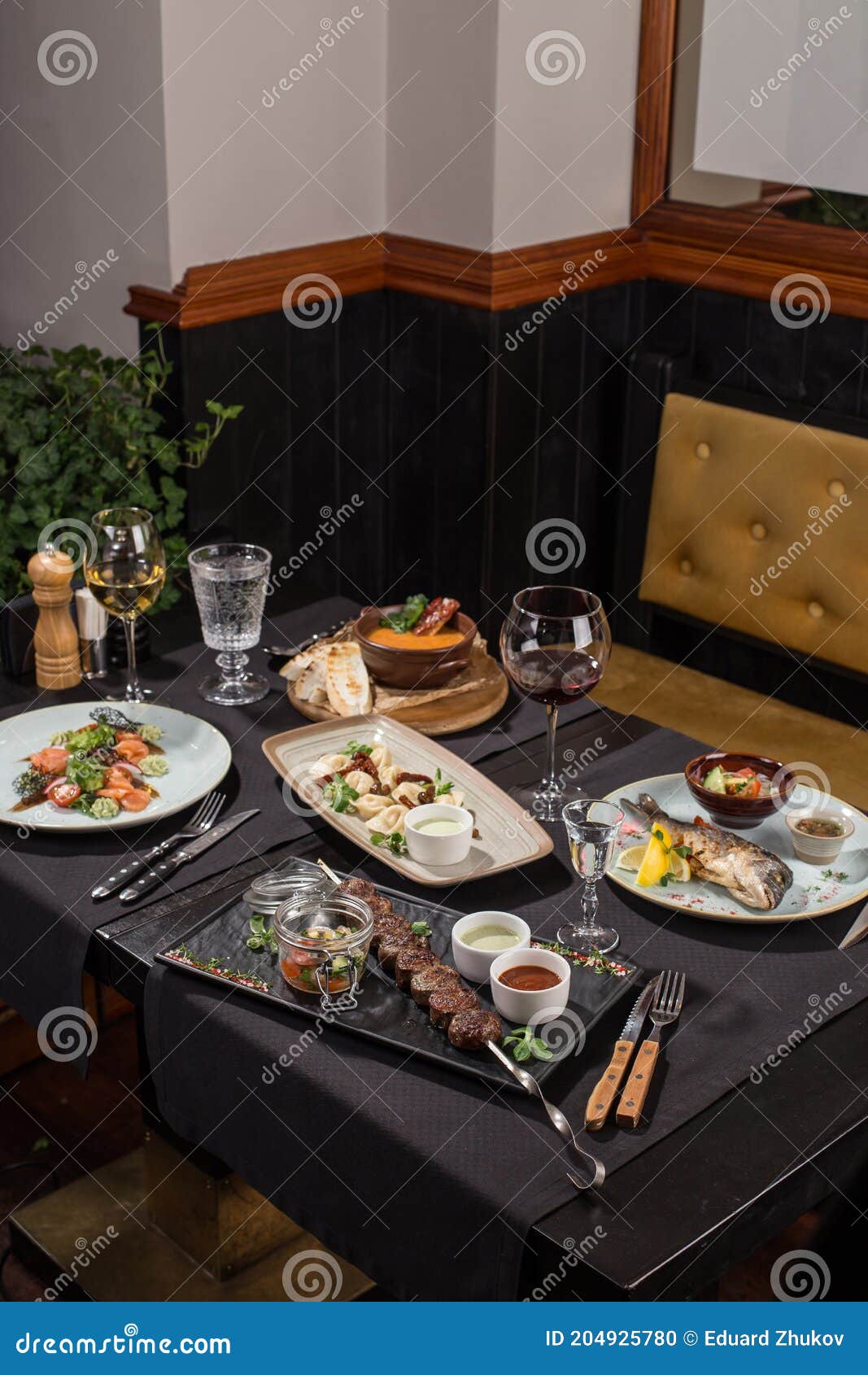 Dining Table Food Set with Appetizer and Drinks in Restaurant Stock ...