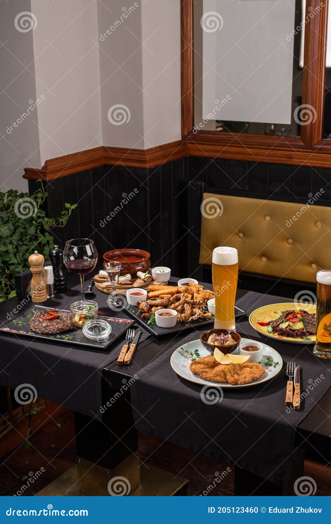 Dining Table Food Set with Beer Appetizer and Drinks in Restaurant ...