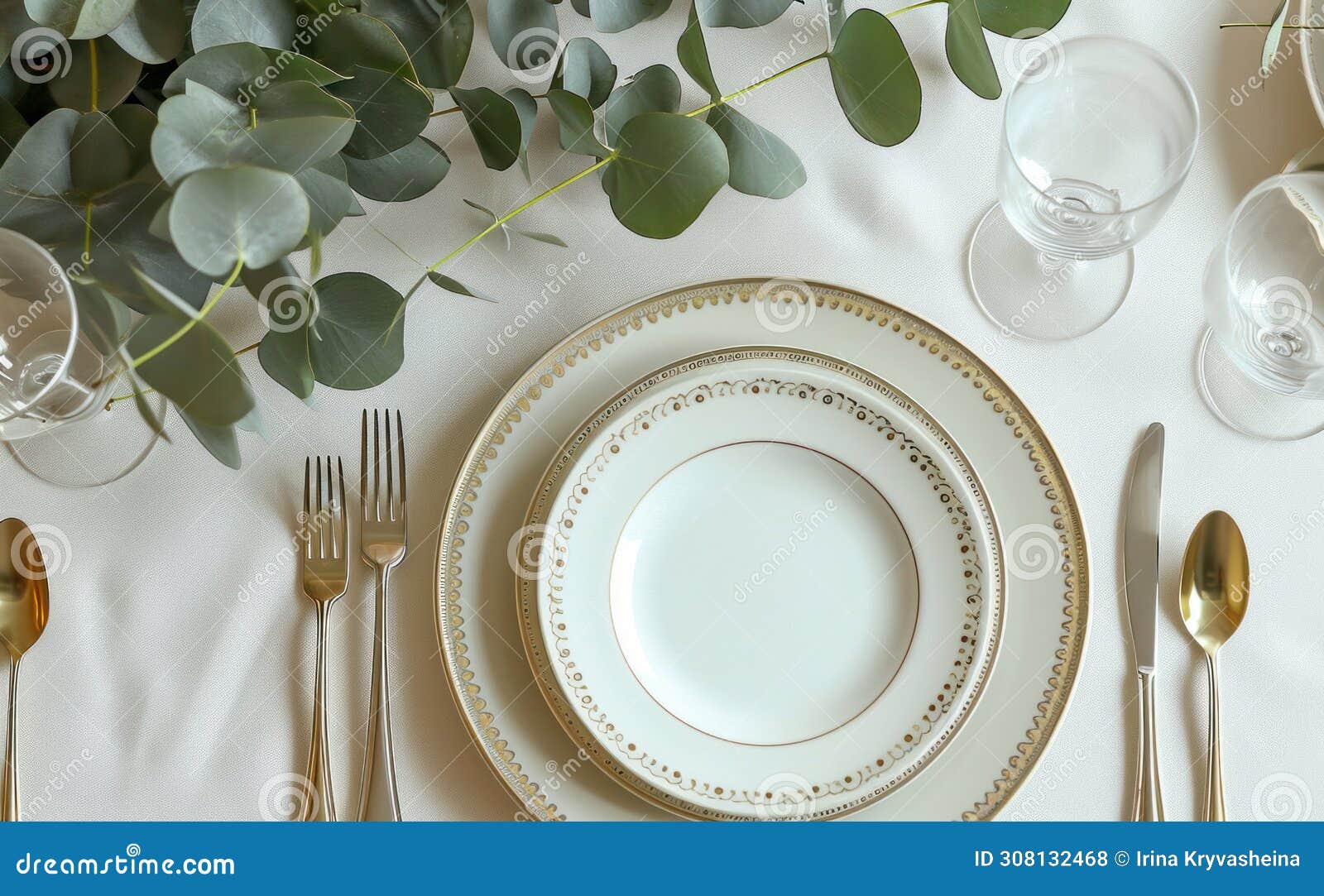 A Dining Table with Place Setting and Eucalyptus Tree Leaf Stock Photo ...