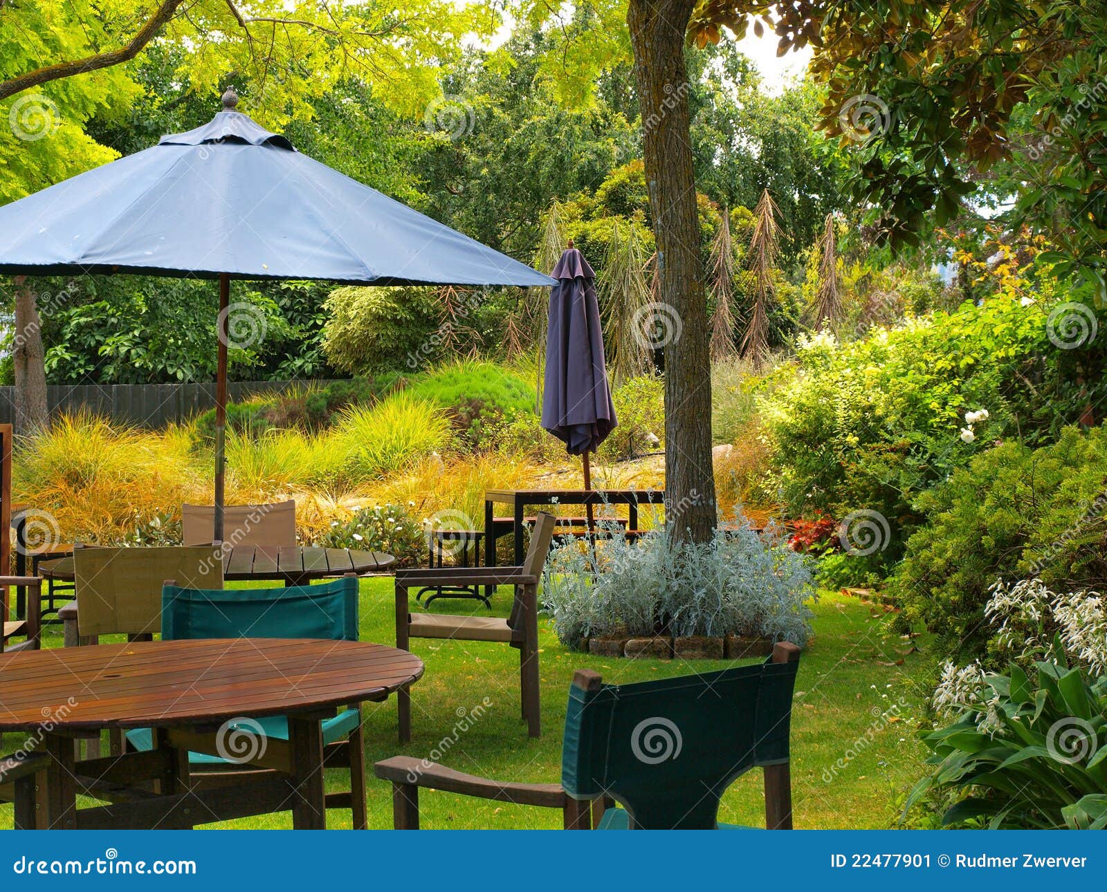 Dining Table in Sunny Garden Stock Image - Image of blue, outdoor: 22477901