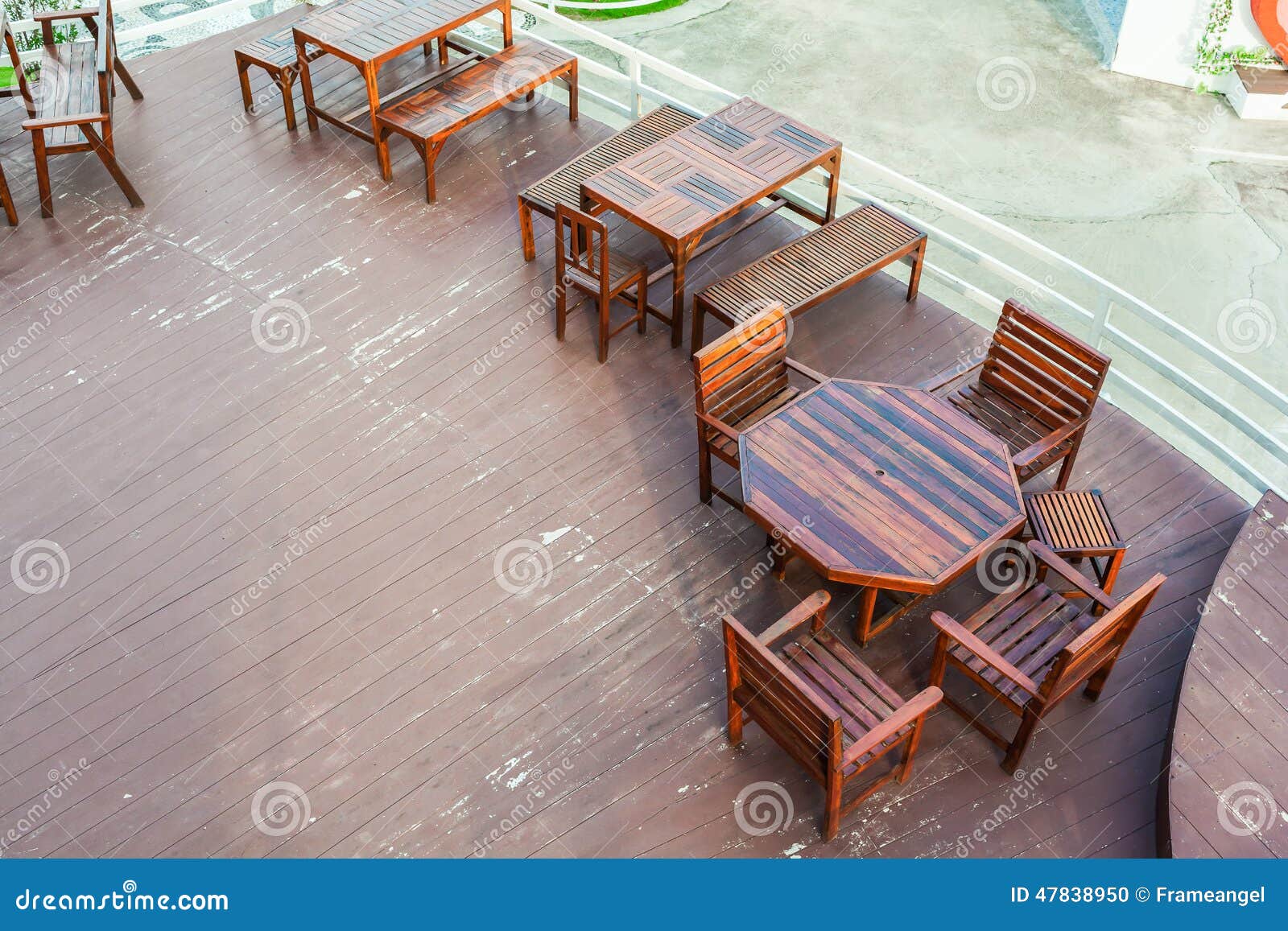 Dining Table on Terrace beside White Fence, Top View Stock Photo ...