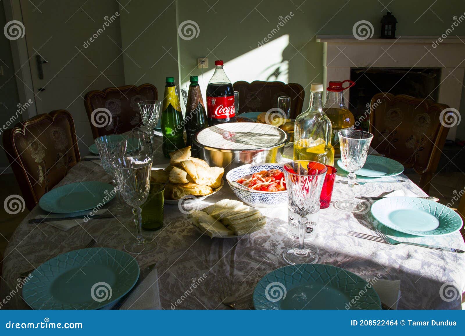Dinner Full Table, Bread, Wine, Tomatoes and Plates Editorial Stock ...