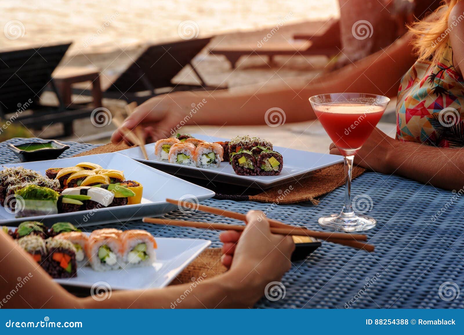 The Dinner with Japanese Sushi at the Beach on the Sunset Stock Photo ...