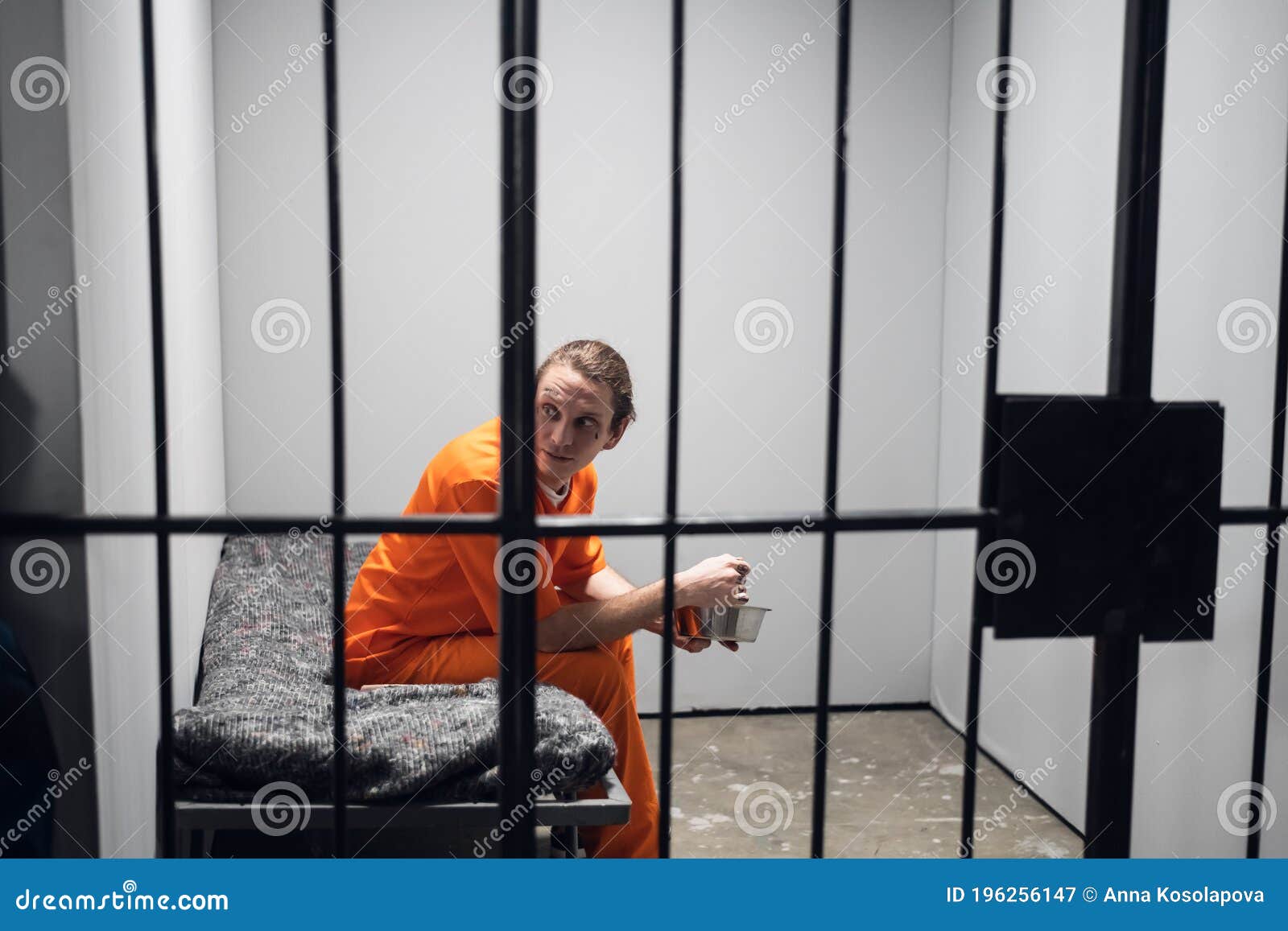 Dinner in a Prison Cell. a Prisoner Eats Tasteless Food from an Iron ...