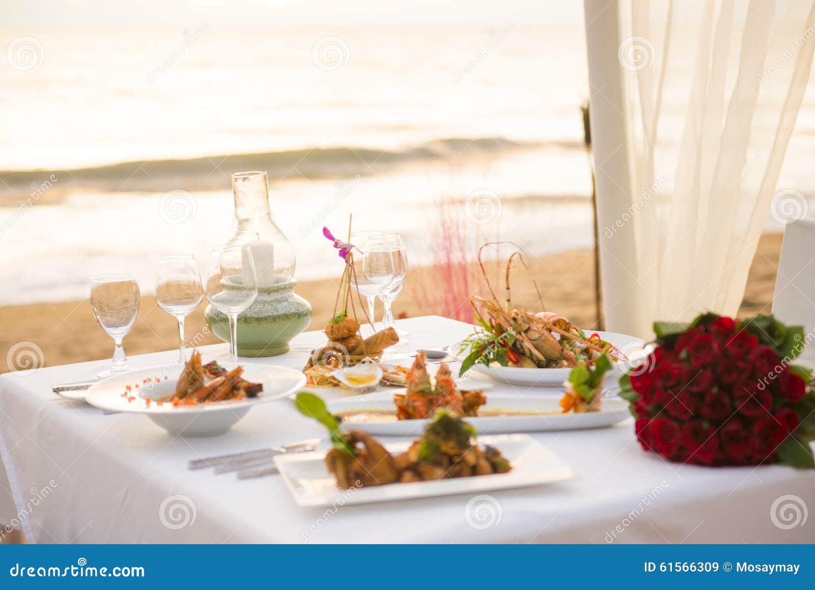 Dinner set up on the beach stock image. Image of table - 61566309