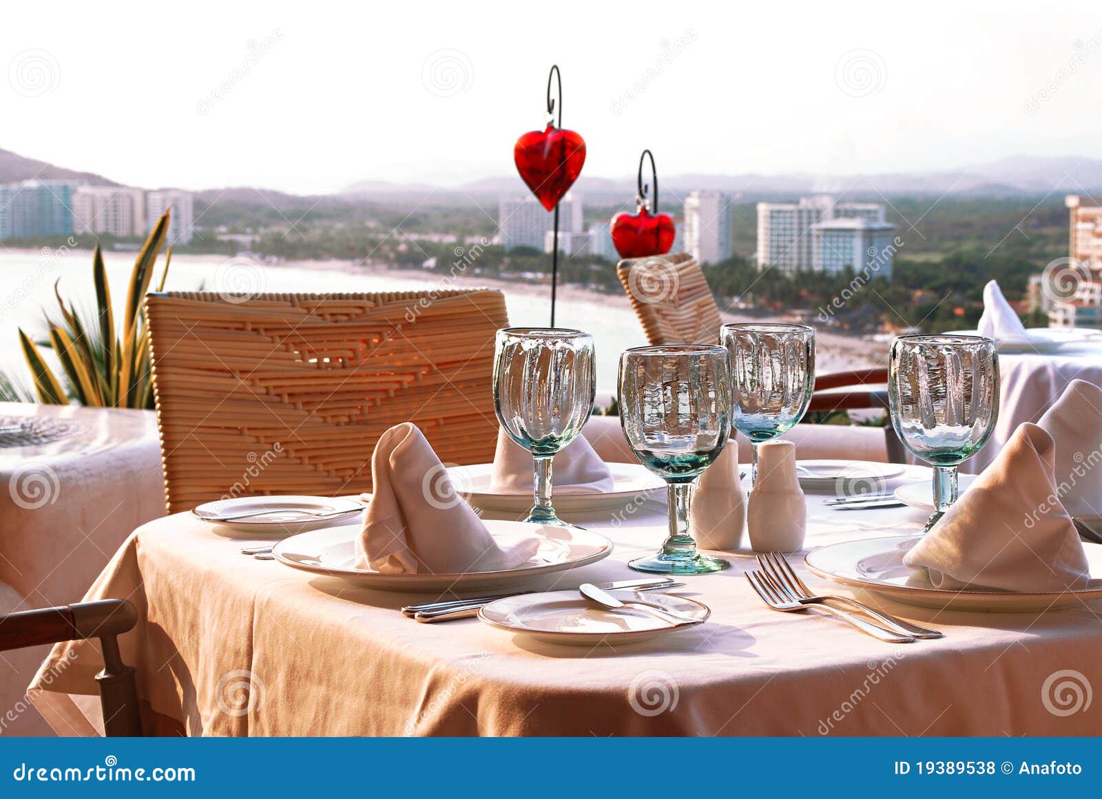 Dinner table with bay view stock photo. Image of plate - 19389538
