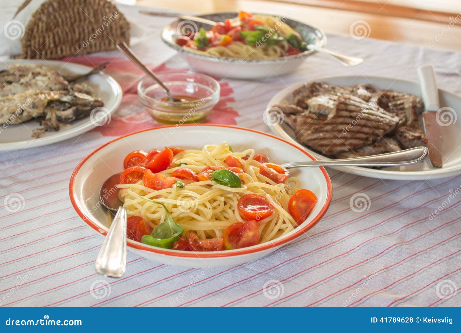 Dinner stock photo. Image of pasta, tomatoes, table, dish - 41789628