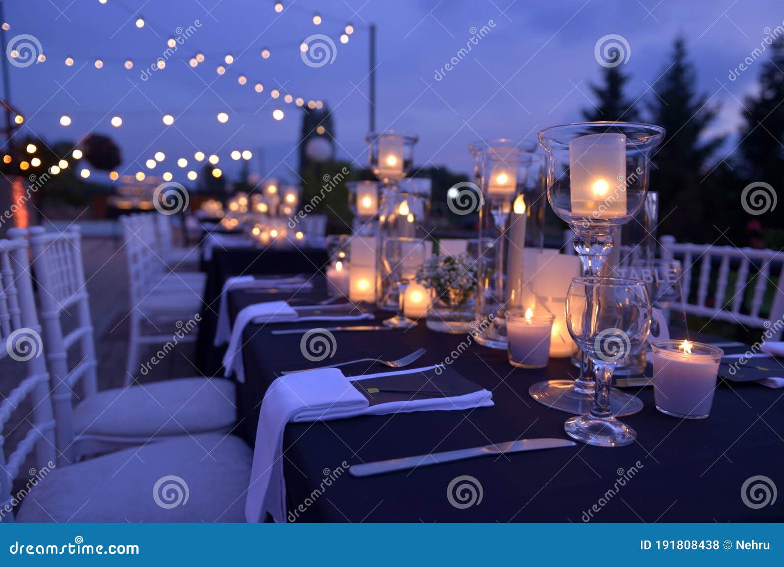 Dinner Table with Candles at a Wedding by Night Stock Photo - Image of ...