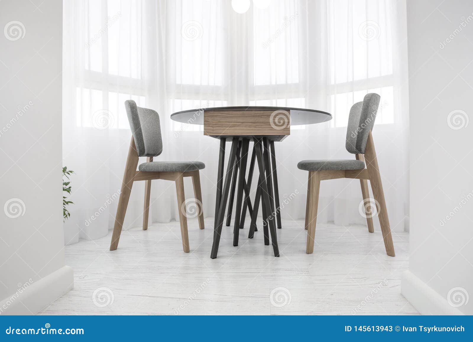 Dinner Tea Table with Chairs on the Balcony in Bright Interior Loft ...