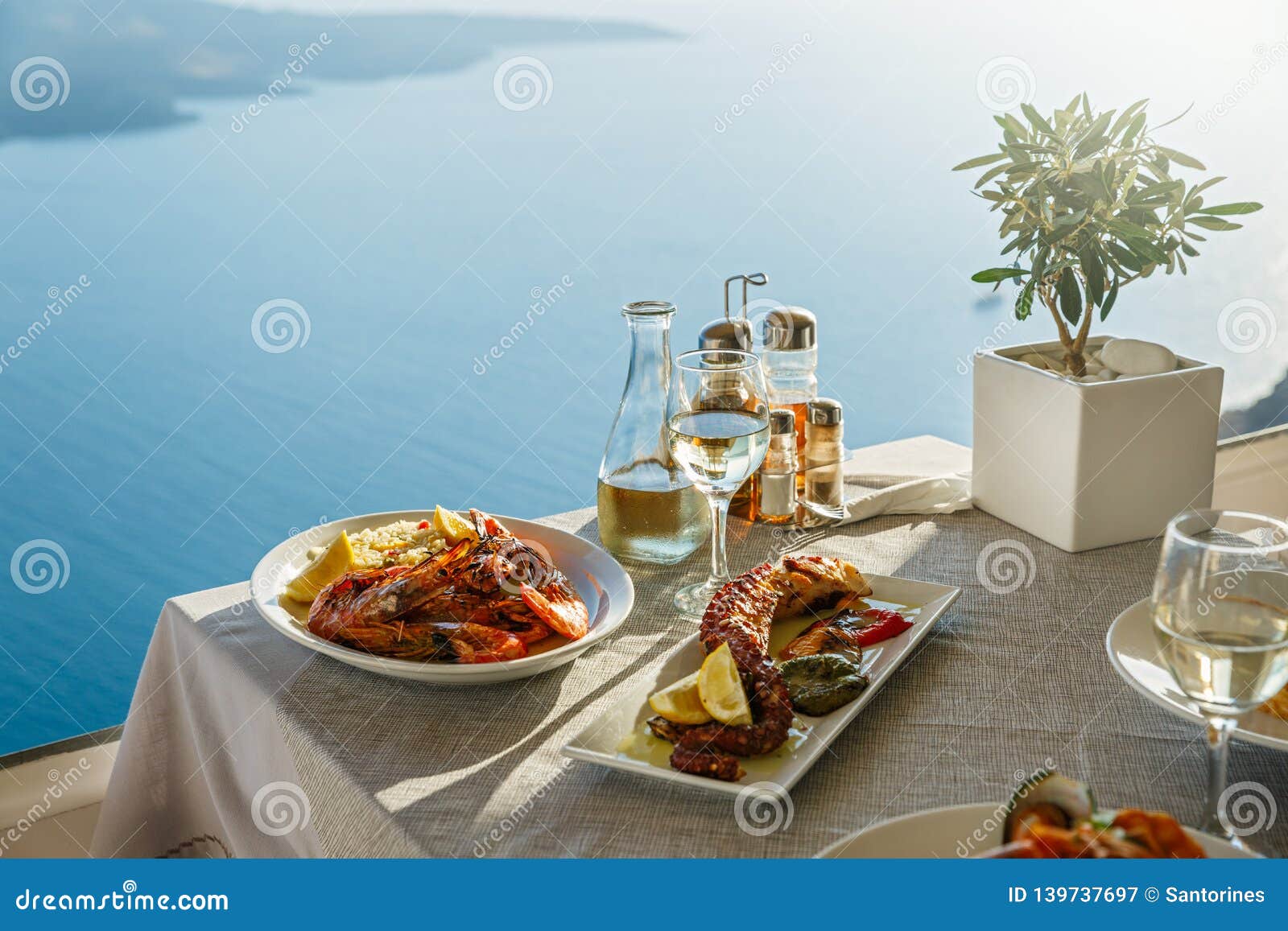 Dinner for Two with Fish Dishes and White Wine Stock Image - Image of ...