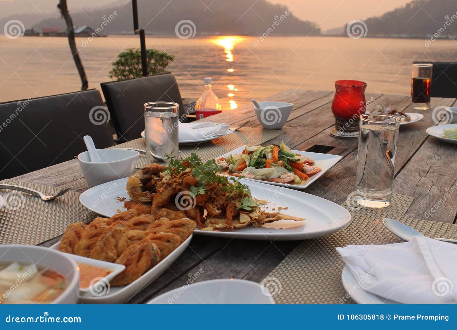 Dinner under the sunset stock photo. Image of blubury - 106305818