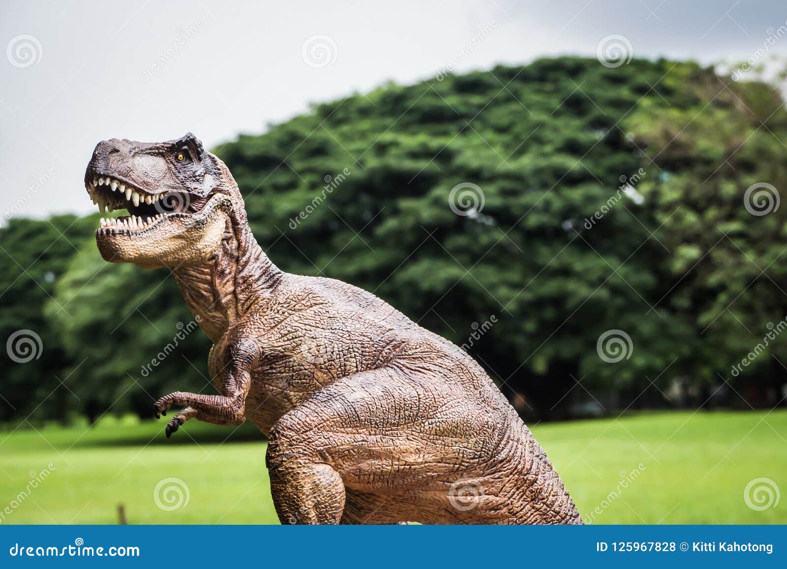 Dinosaur , T-rex with Tree Branches Against on the Nature Stock Photo ...