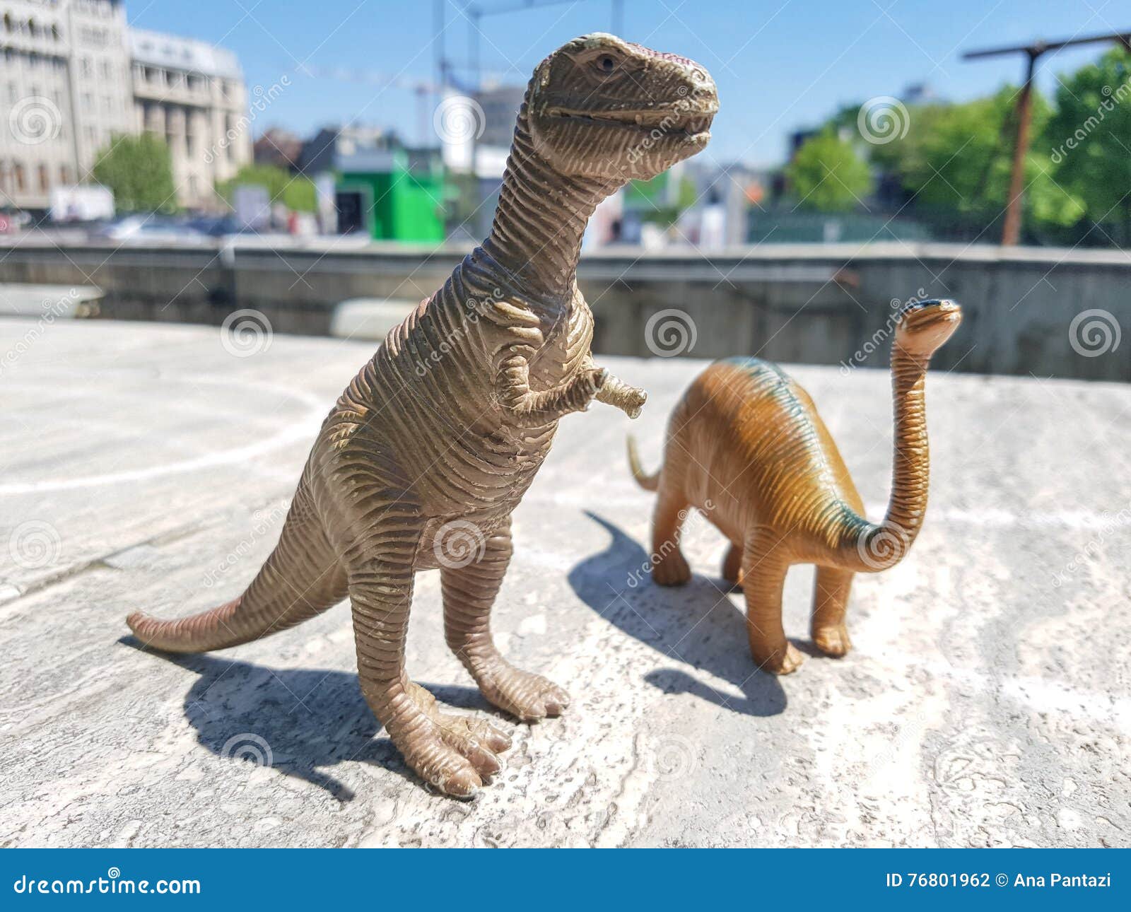 Dinosaurs in town stock photo. Image of town, dinosaurs - 76801962