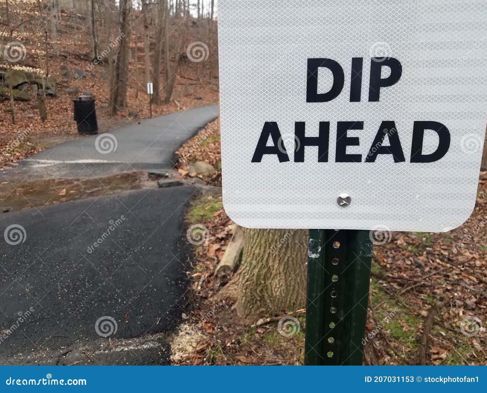 Dip Ahead Sign on Path or Trail with Water Stock Image - Image of ...